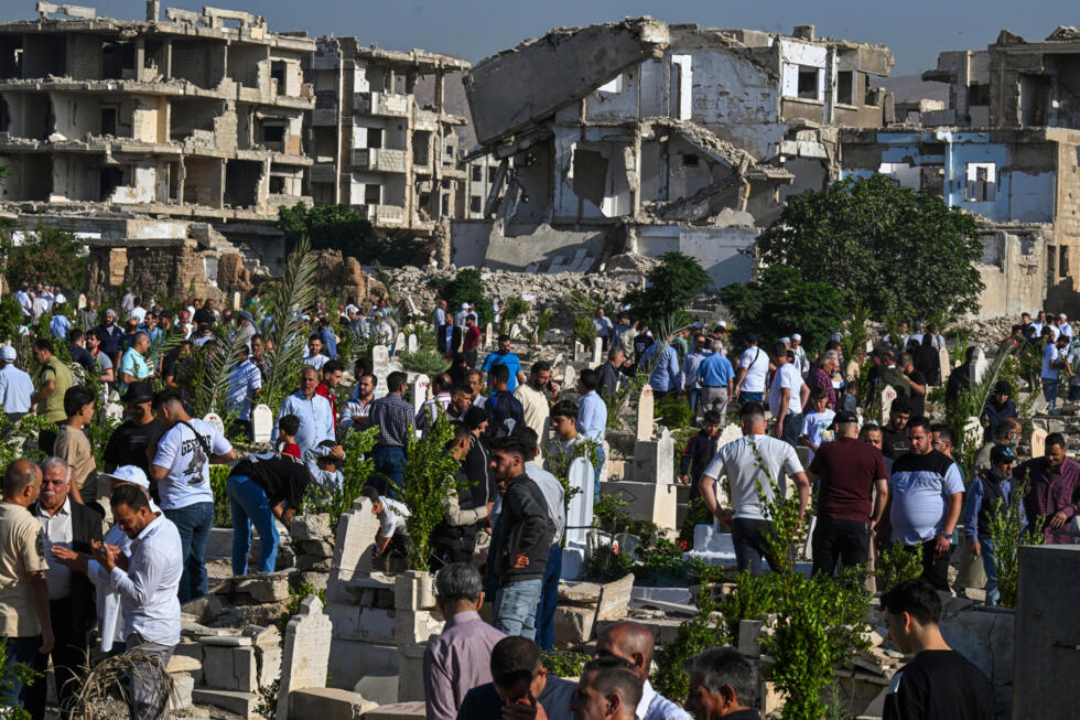 In Syria's devastated Jobar, cemetery comes alive for Eid