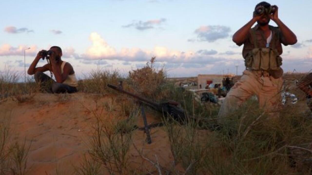 Opposition fighters surround pro-Gaddafi bastion as truce ends