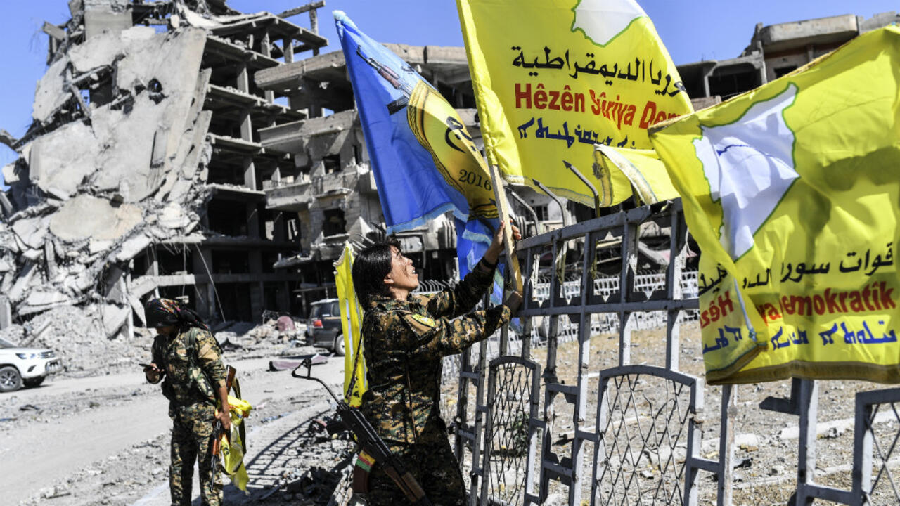 US-backed forces celebrate victory over IS group in Syria’s Raqqa