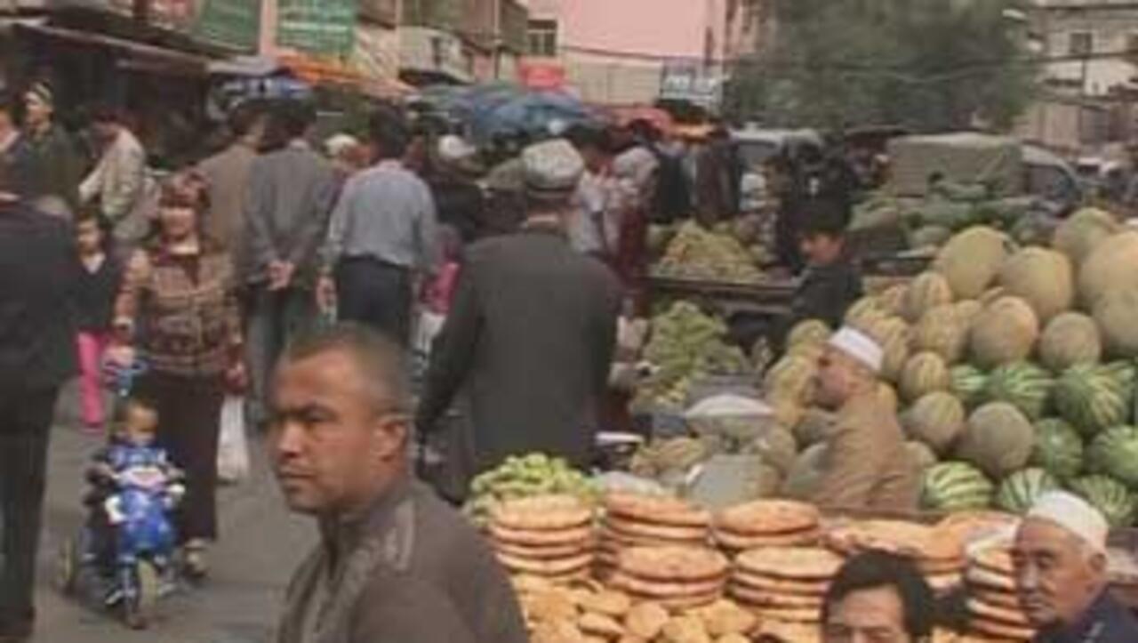 Uneasy calm returns to Urumqi after sacking of Chinese officials