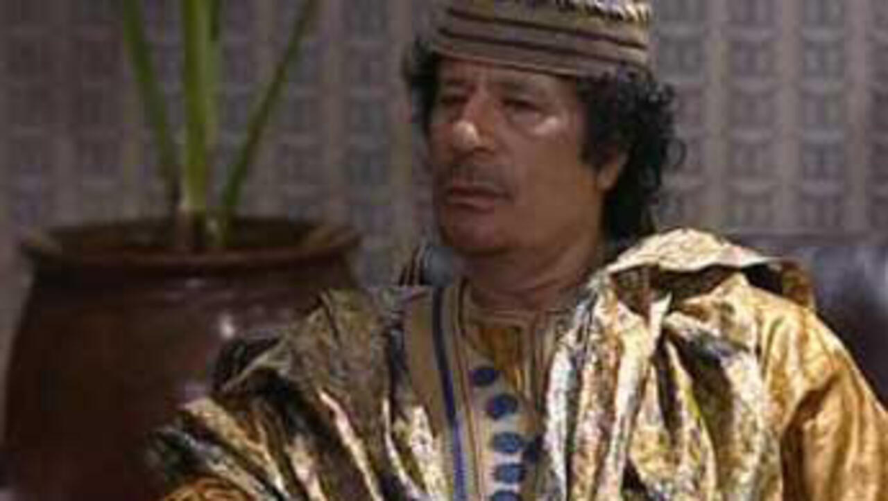 On state visit, Gaddafi gets a mixed welcome from politicians