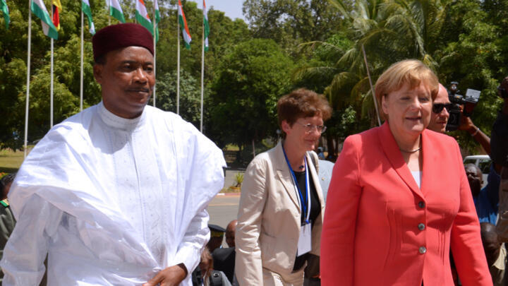 Merkel promises millions in aid to stem migrant flow on Africa tour