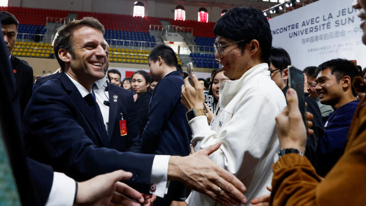 Macron mobbed by screaming students and fans on final day of China trip