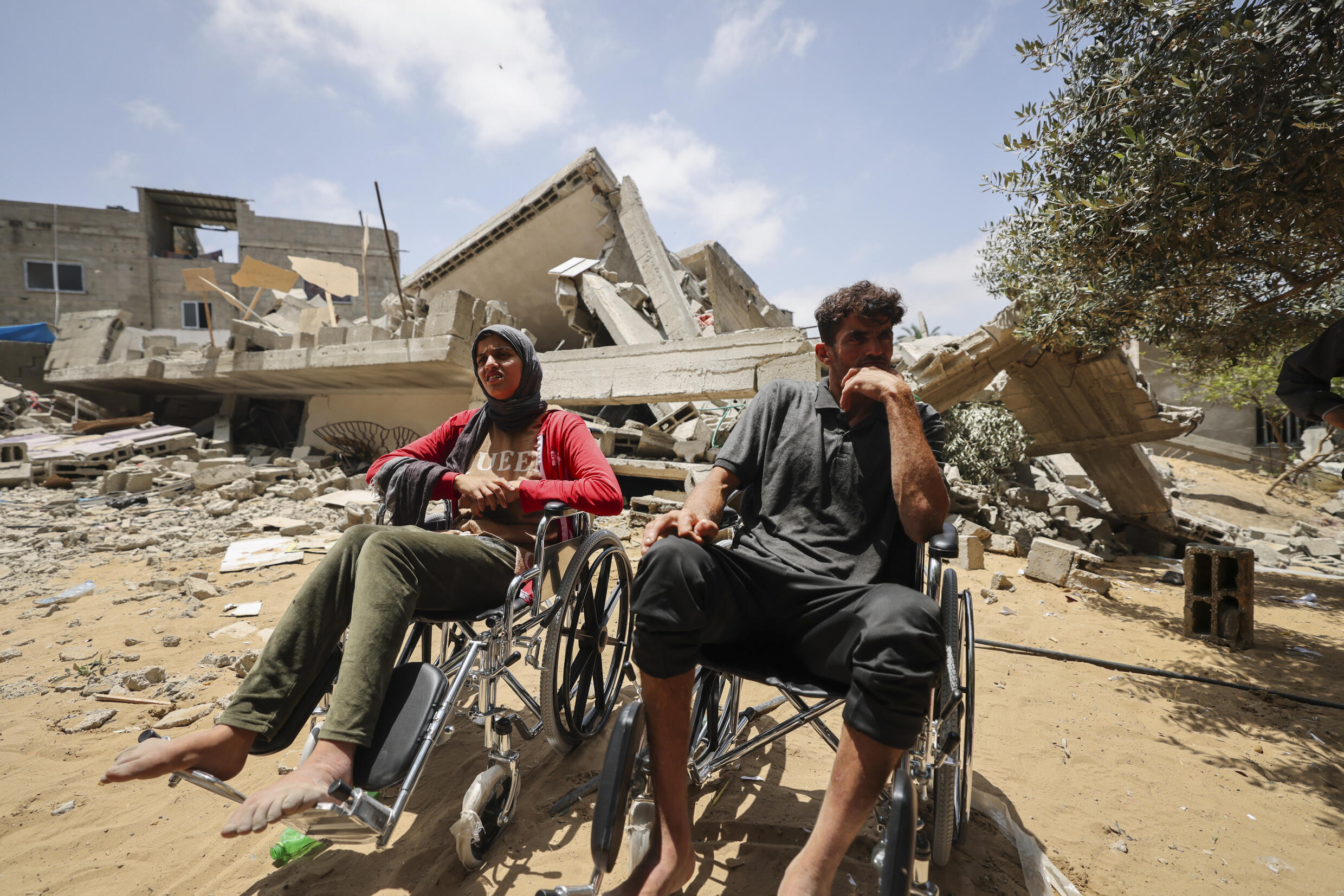 Gazans amid the rubble of homes flattened by fighting