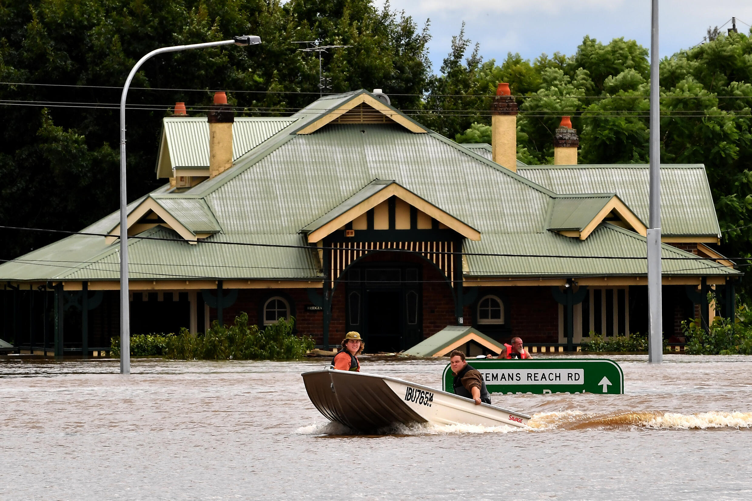 Protesters rally as Australian PM tours flood disaster