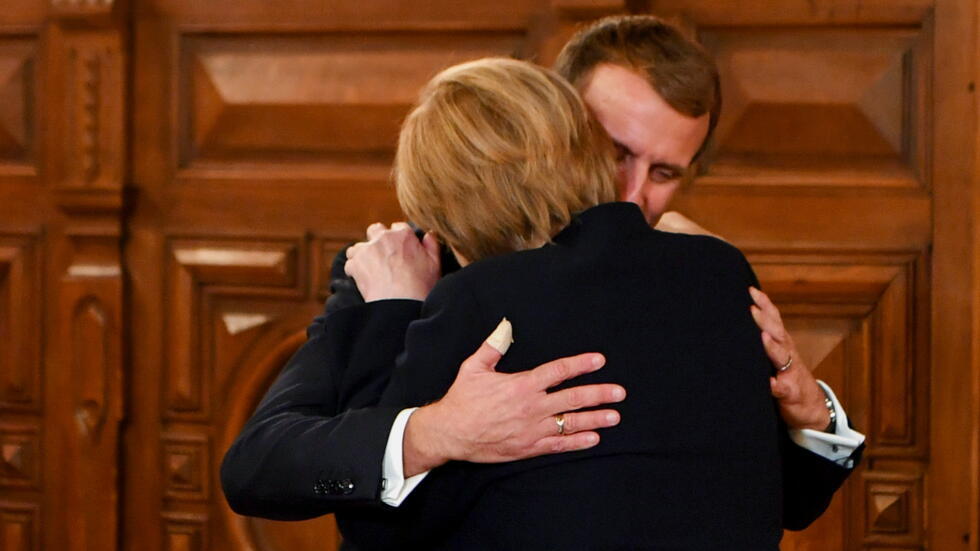 Macron thanks Merkel for 'keeping Europe united' in last toast