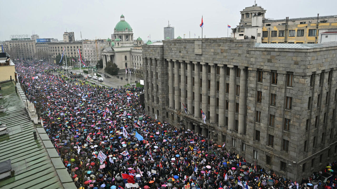 Tens of thousands of anti-government protesters converge in Belgrade