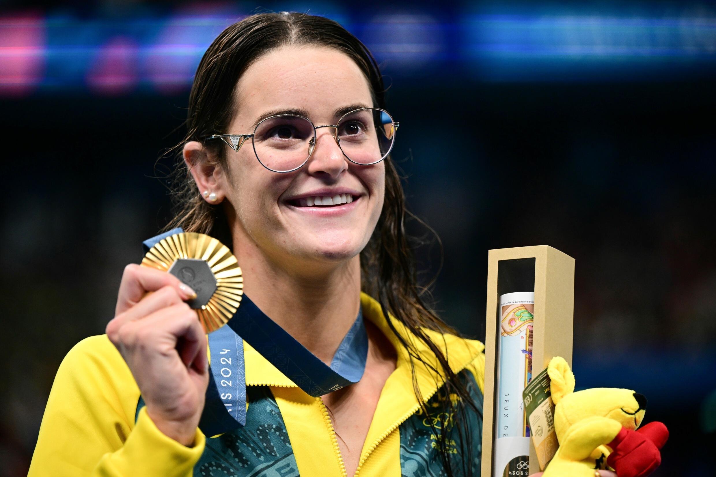Australia's McKeown roars back to retain 100m backstroke gold