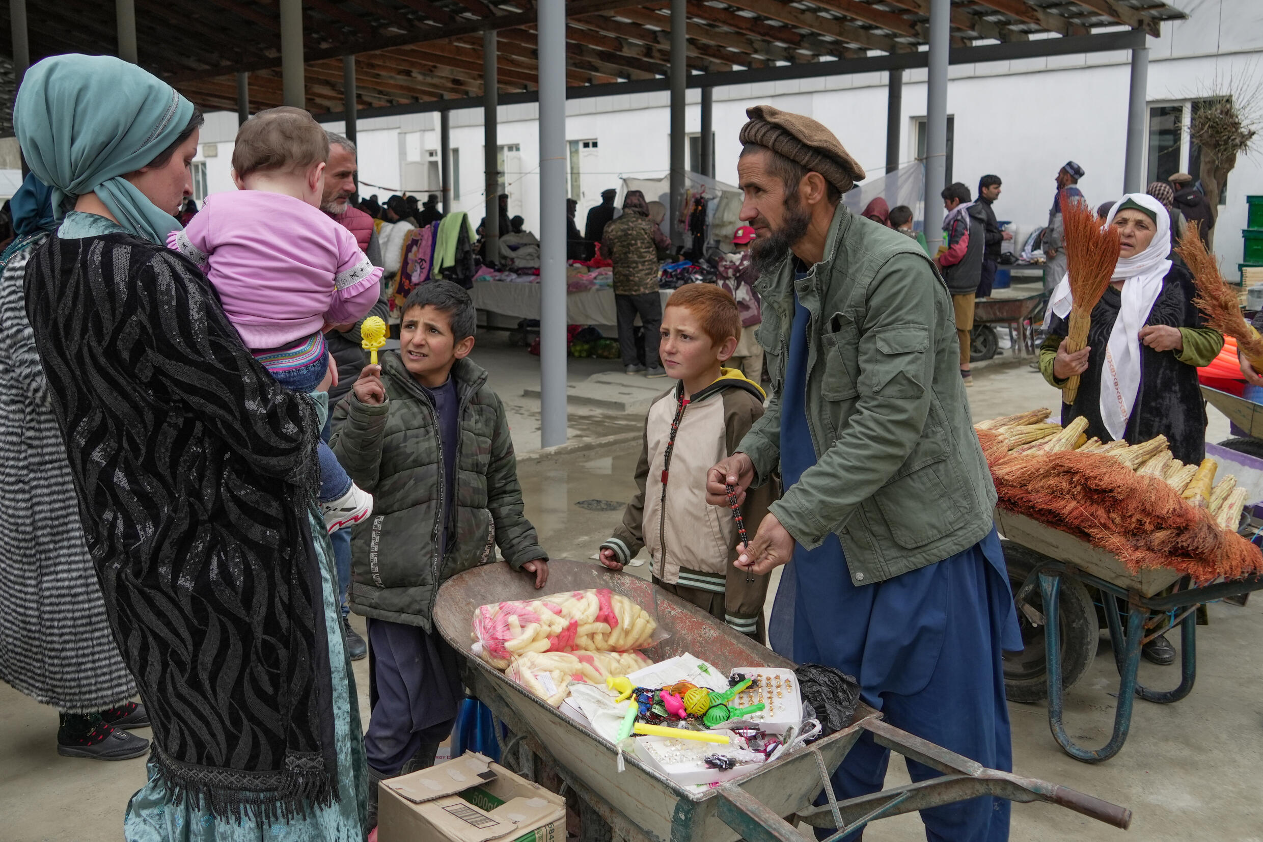 Afghans and Tajiks mix in rare but vital border bazaar