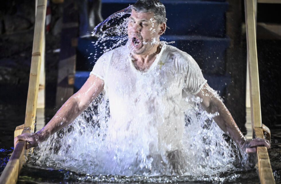 Russians take Epiphany dip in waters hit by oil spill