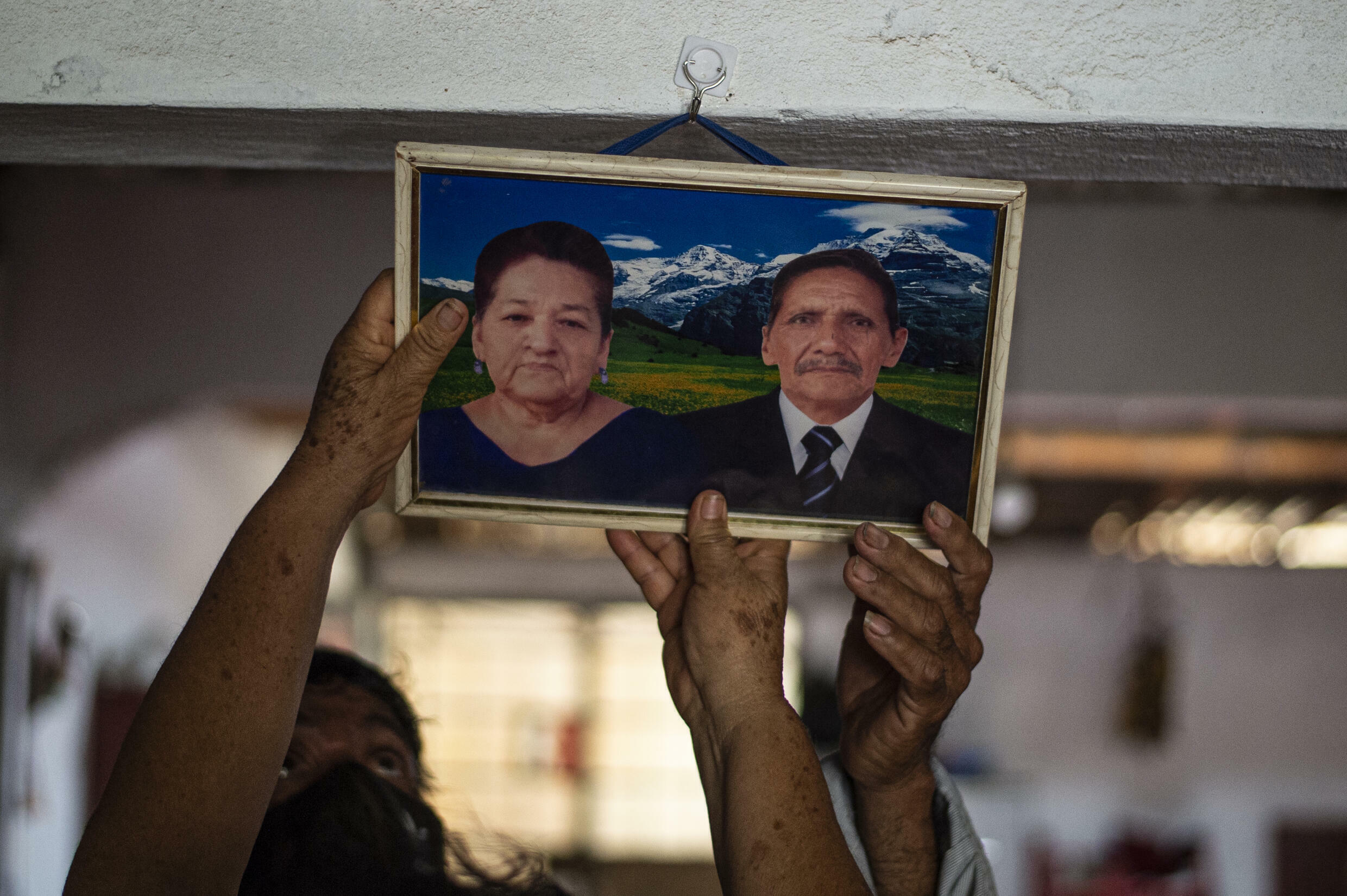 Only photos left as Peruvians mourn their Covid dead