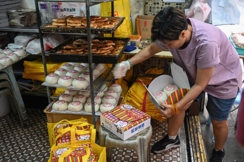 Child mascots and bun towers: Hong Kong keeps island traditions alive