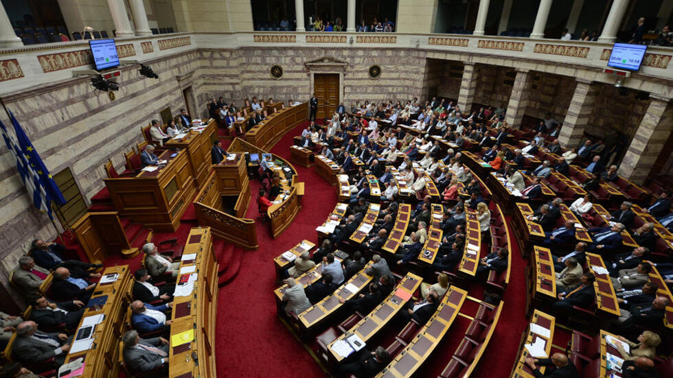Greek lawmakers approve third bailout deal, Tsipras faces confidence vote