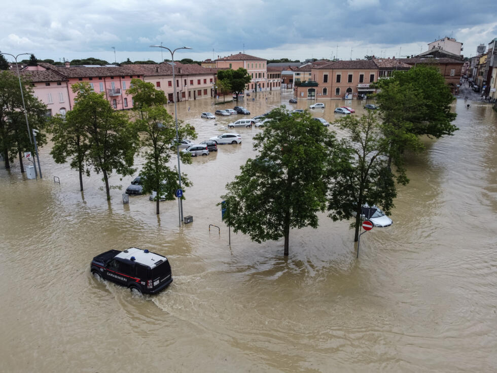 Italy flood deaths rise to 13 as thousands wait to come home